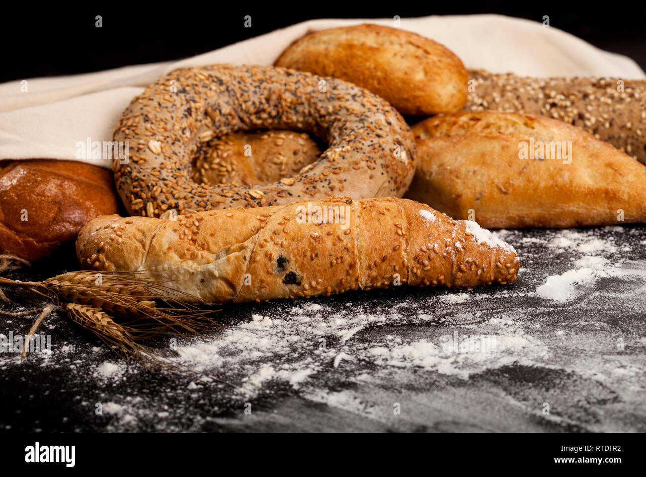 Assortment of baked goods on dark background Stock Photo - Alamy