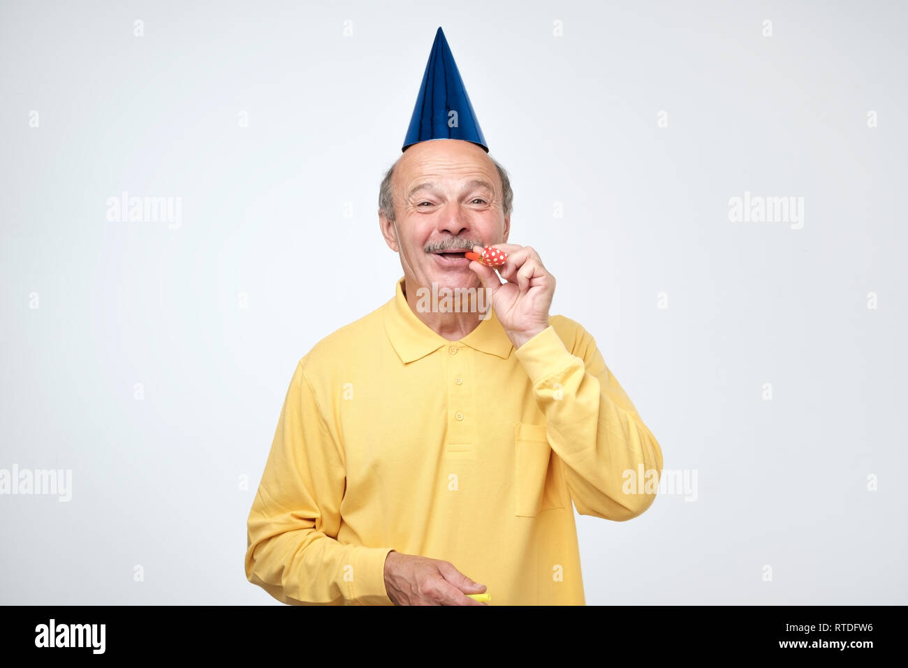 Man blowing into horn hi-res stock photography and images - Alamy