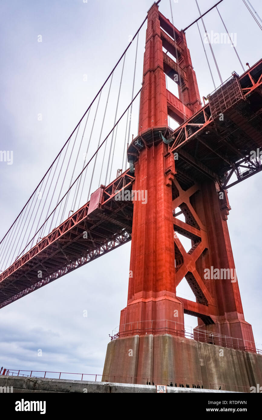 Golden Gate bridge as seen from below on a cloudy day, San Francisco ...