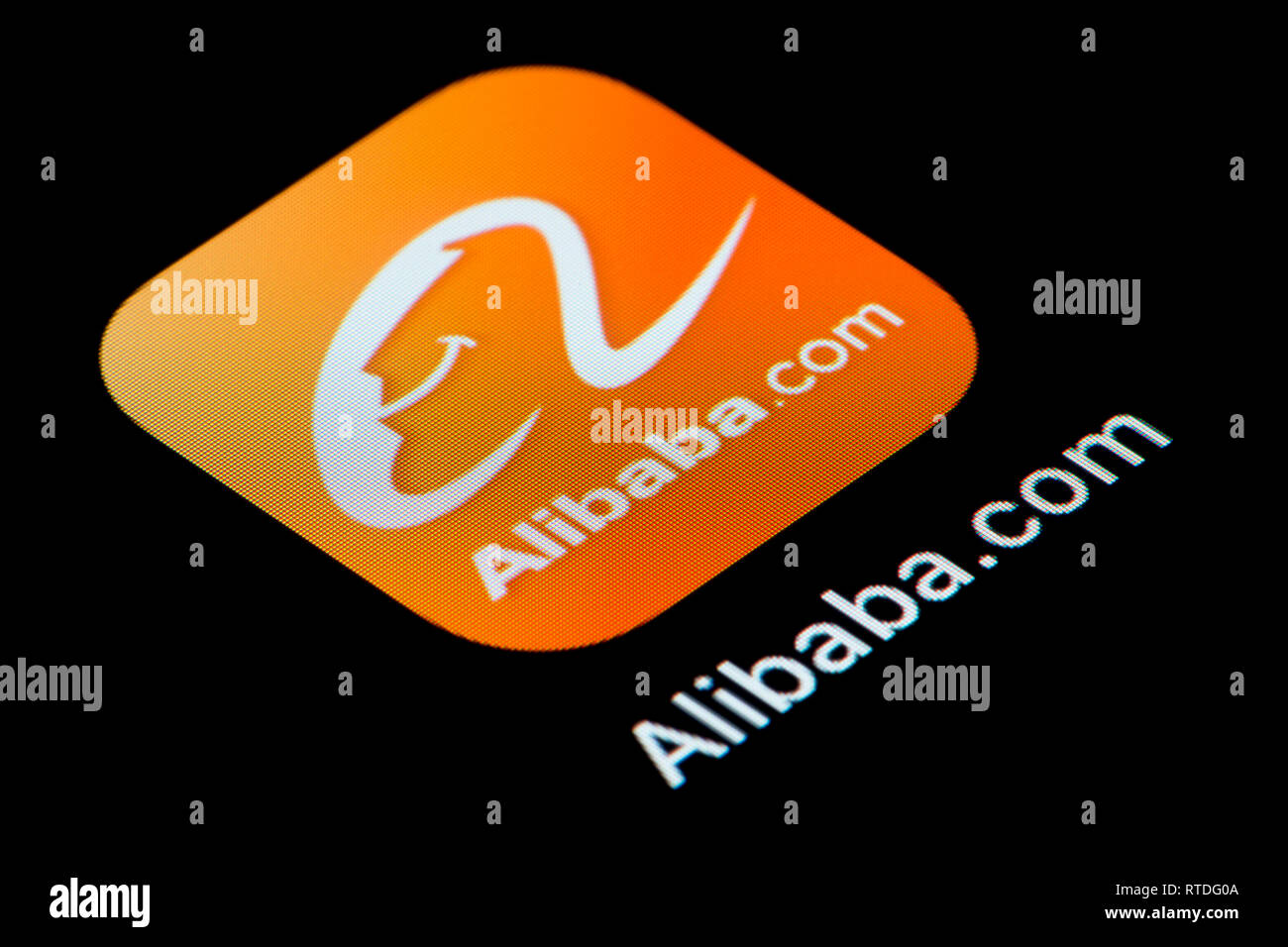 A close-up shot of the Alibaba app icon, as seen on the screen of a ...