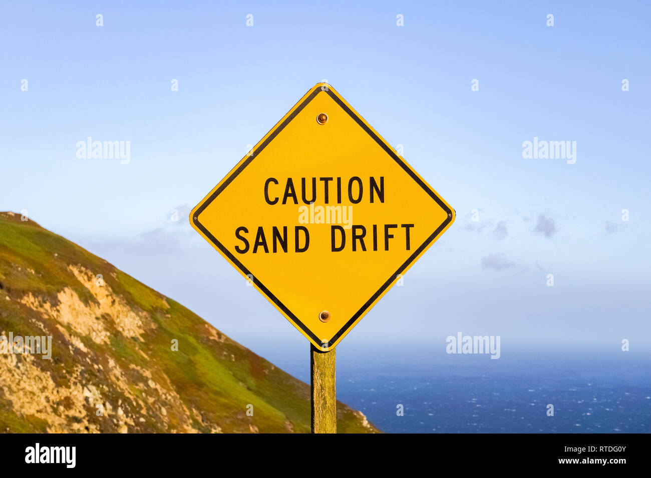 Sand drift sign on the Pacific Ocean Coast, California Stock Photo - Alamy