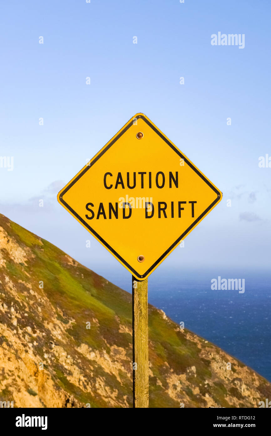 Sand drift sign on the Pacific Ocean coast, California Stock Photo - Alamy