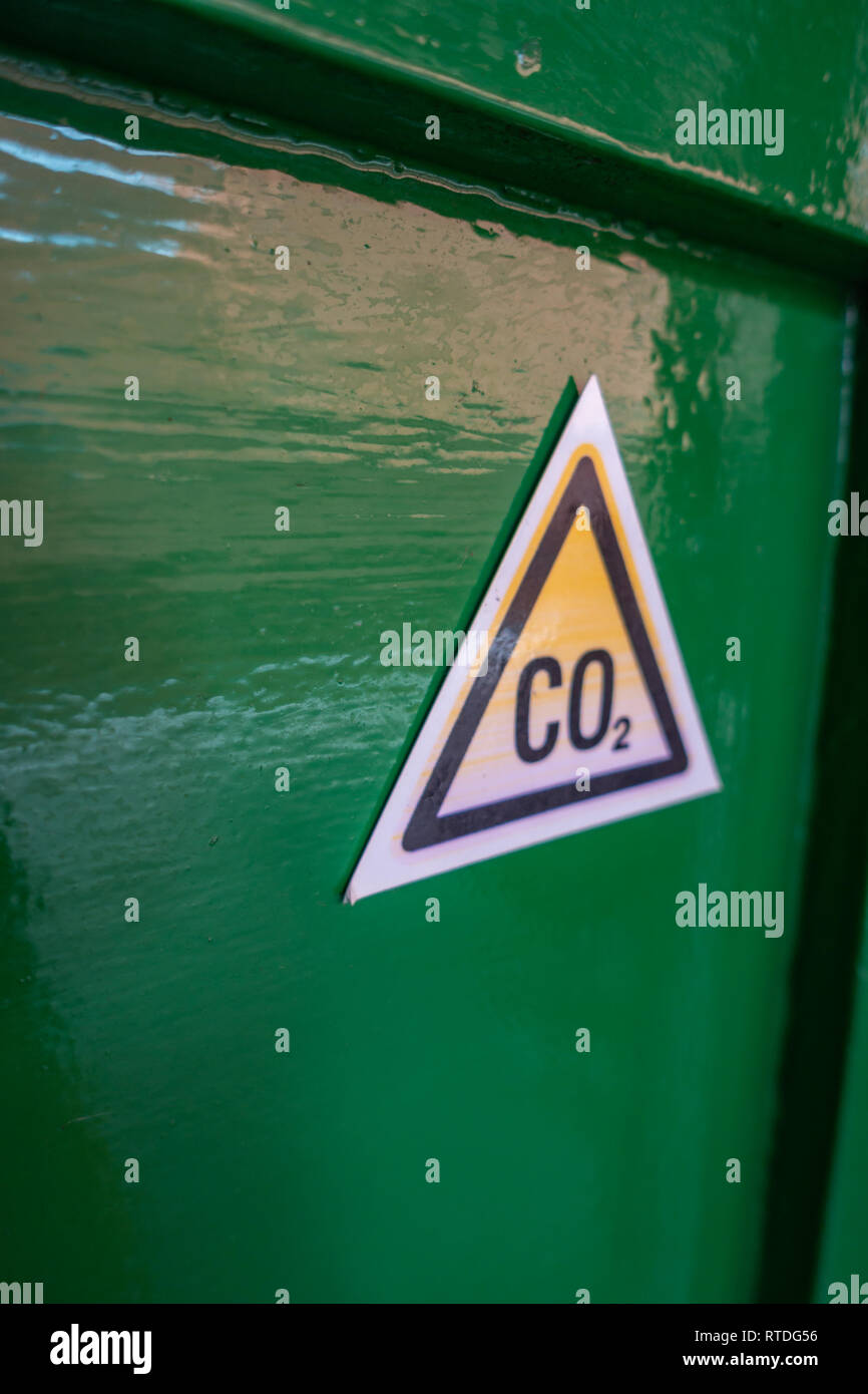 Closeup of CO2 triangle warning sign on green door Stock Photo - Alamy