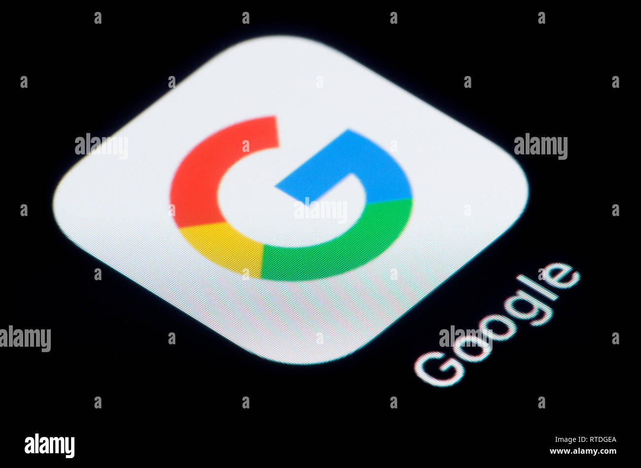 A close-up shot of the Google app icon, as seen on the screen of a ...