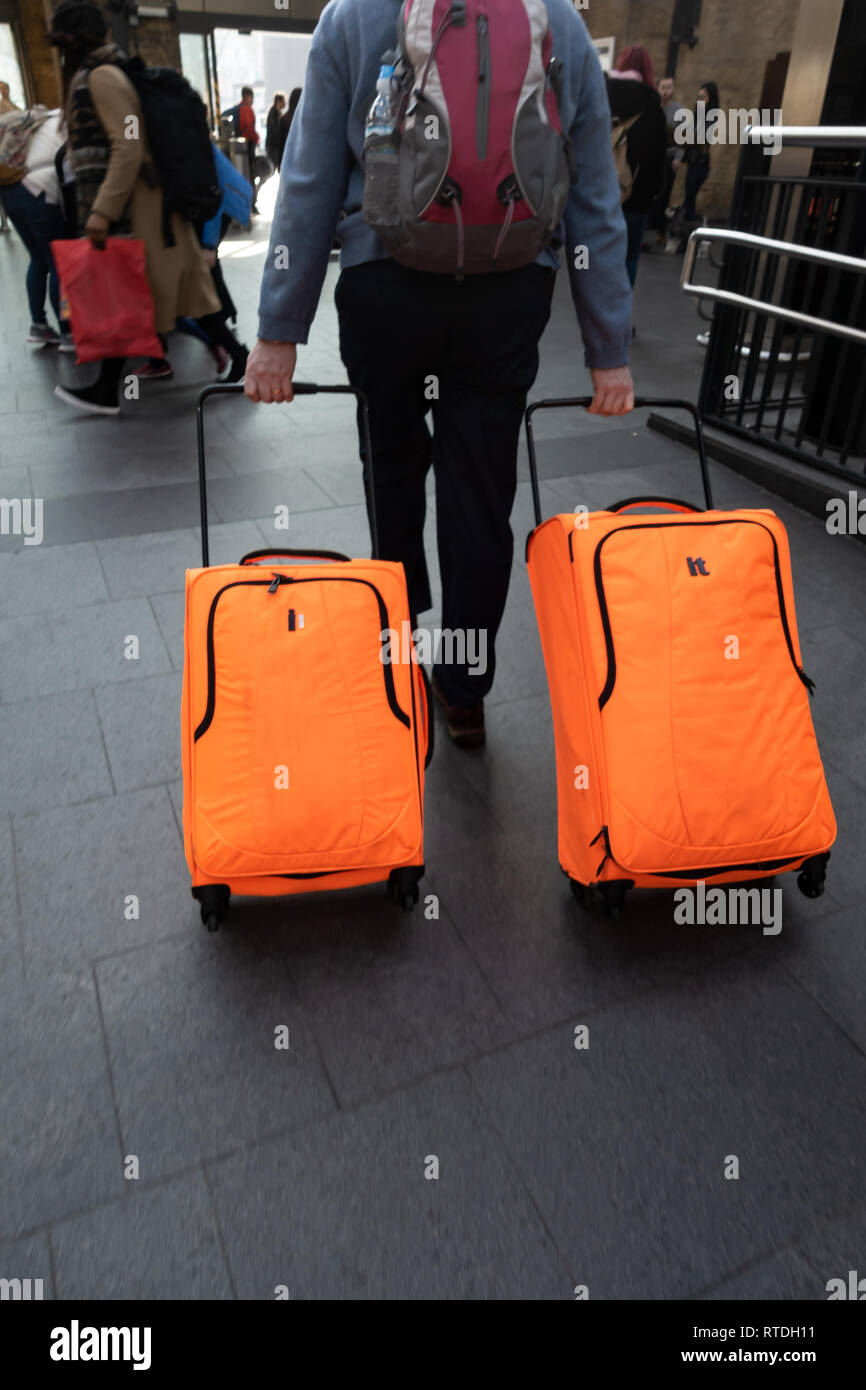 Two man pulling luggage bag hi-res stock photography and images - Alamy