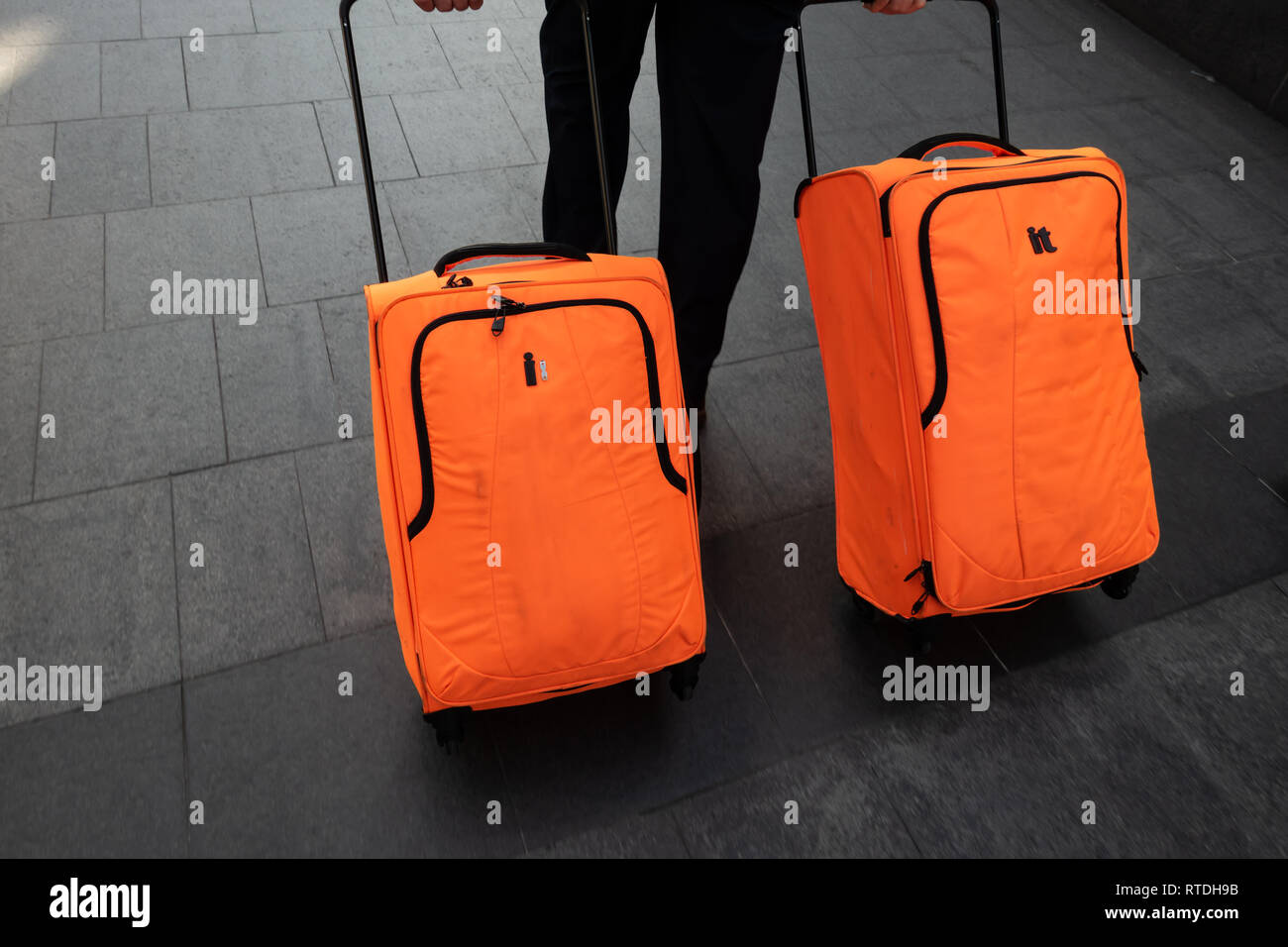 Two man pulling luggage bag hi-res stock photography and images - Alamy