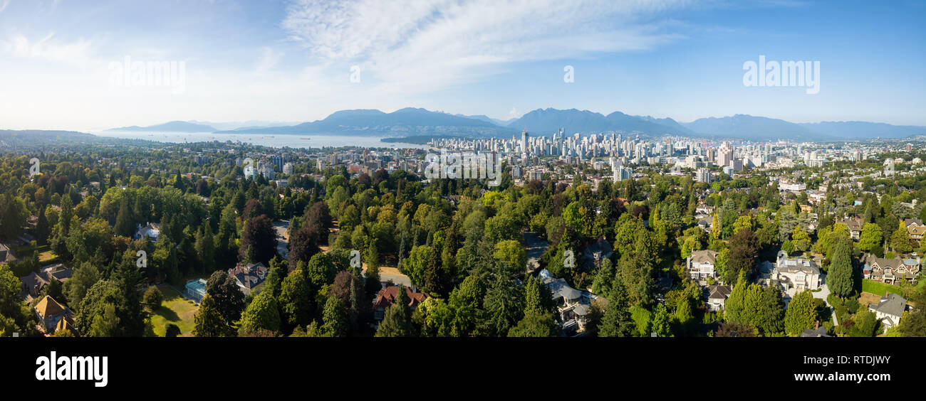 Aerial Panoramic view of a modern city during a sunny summer day. Taken ...