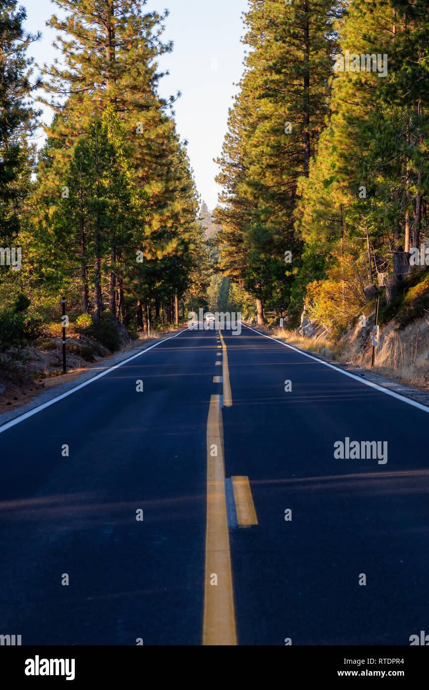 Scenic road in the mountains during a vibrant morning sunrise. Taken in ...