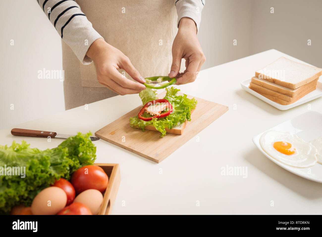 Preparing and eating breakfast at home in morning Stock Photo - Alamy