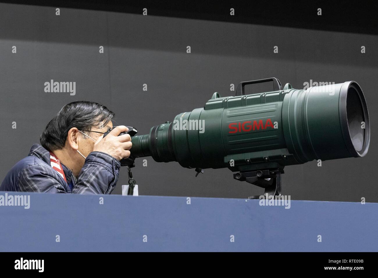 A man tests a Sigma lens 200-500mm f2.8 EX DG during the CP Plus Camera ...