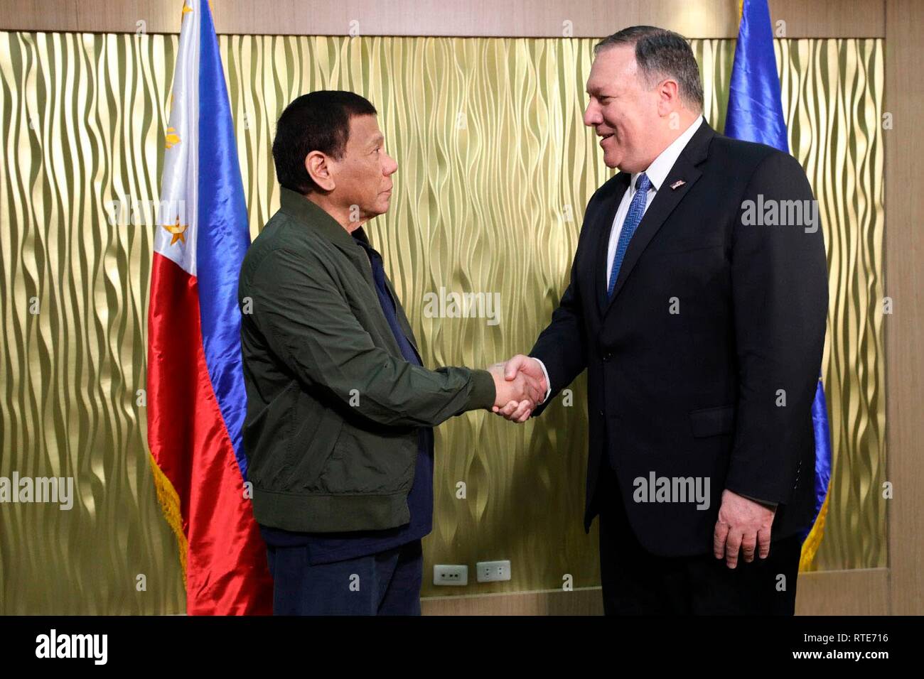 U.S Secretary of State Mike Pompeo, right, shakes hands with Philippine ...
