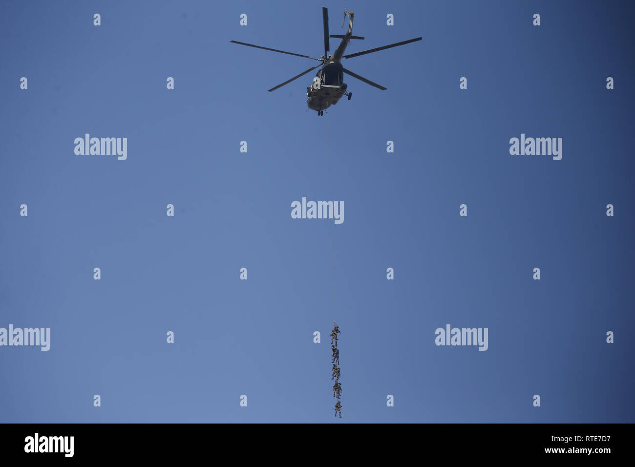 Kathmandu, Nepal. 1st Mar, 2019. Nepalese Army soldiers hang onto a ...