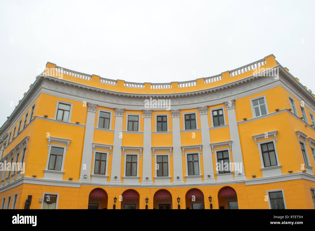 High angle view on a yellow color building. Looking up to bright color ...