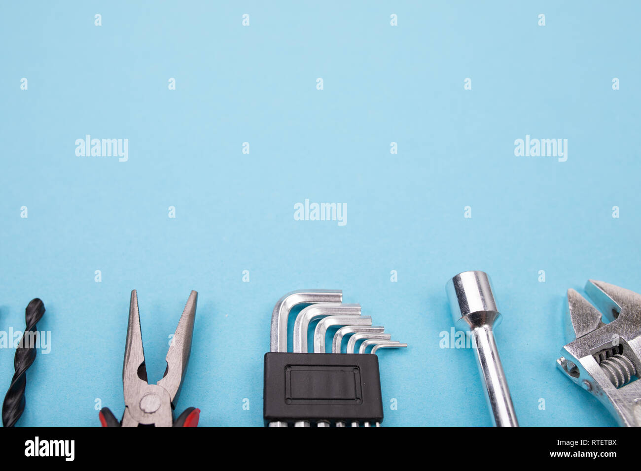 Set of different tools on blue background Stock Photo - Alamy