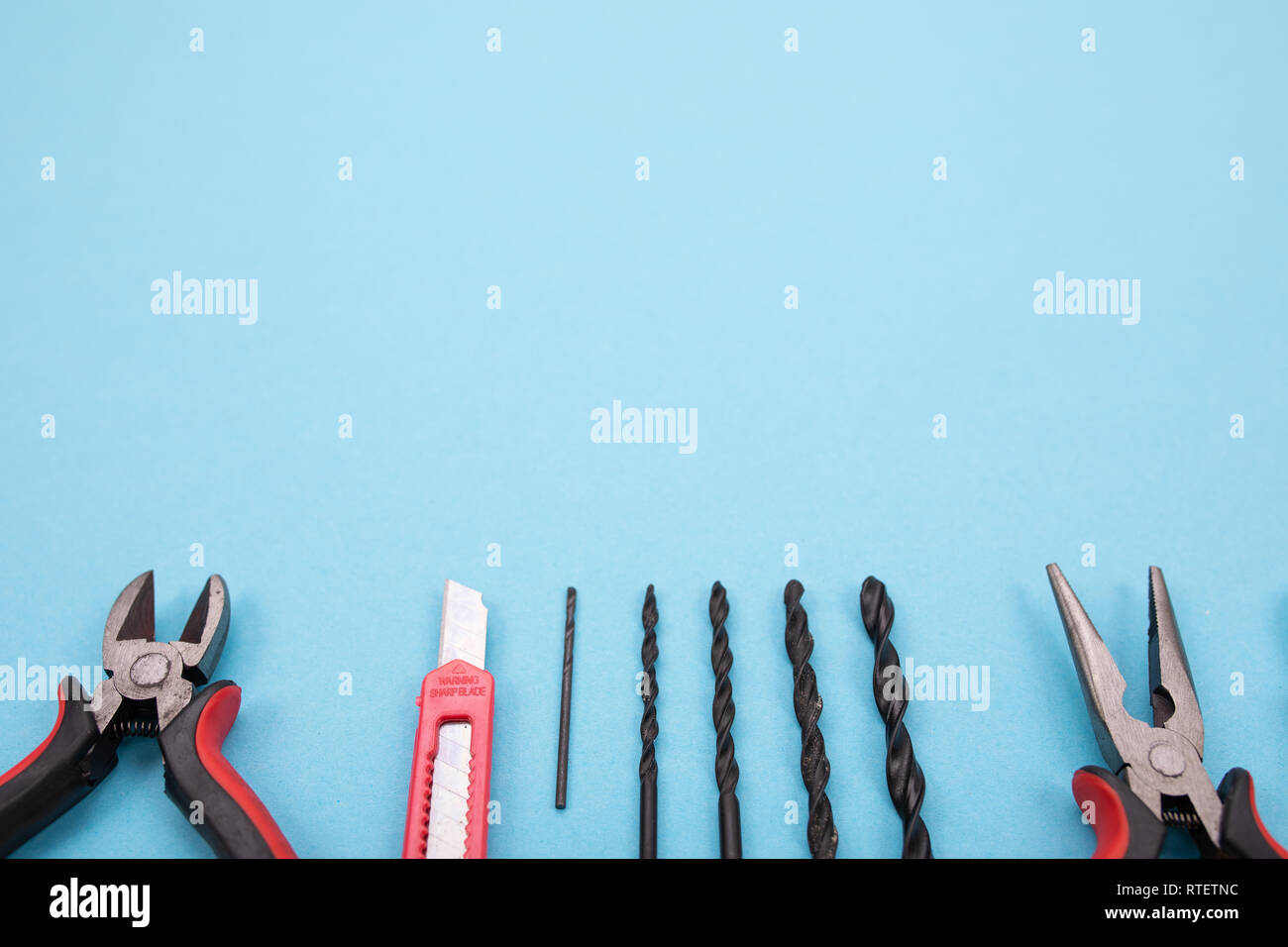 Set of different tools on blue background Stock Photo - Alamy