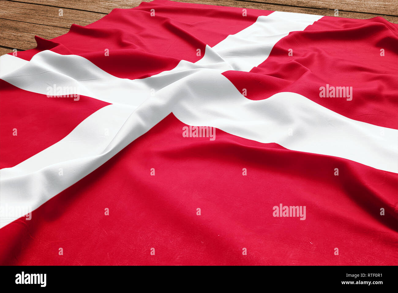 Flag of Denmark on a wooden desk background. Silk Danish flag top view ...
