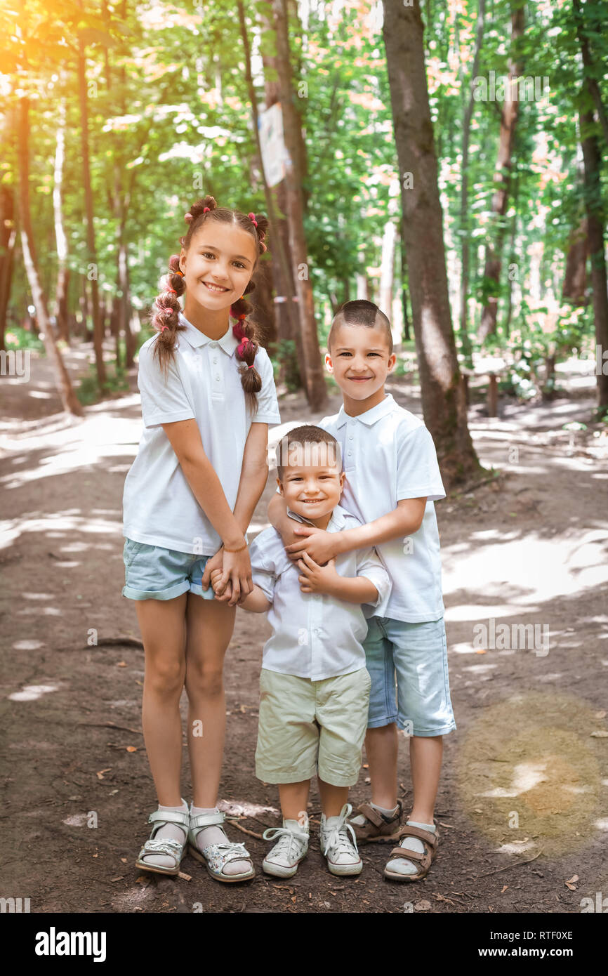 Happy children in forest Stock Photo - Alamy