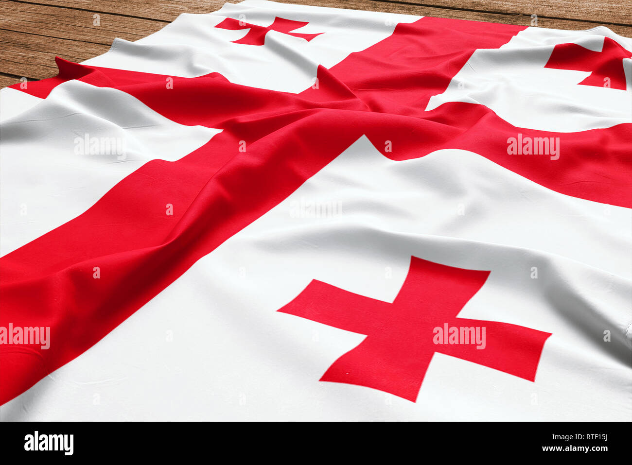 Flag of Georgia on a wooden desk background. Silk Georgian flag top ...