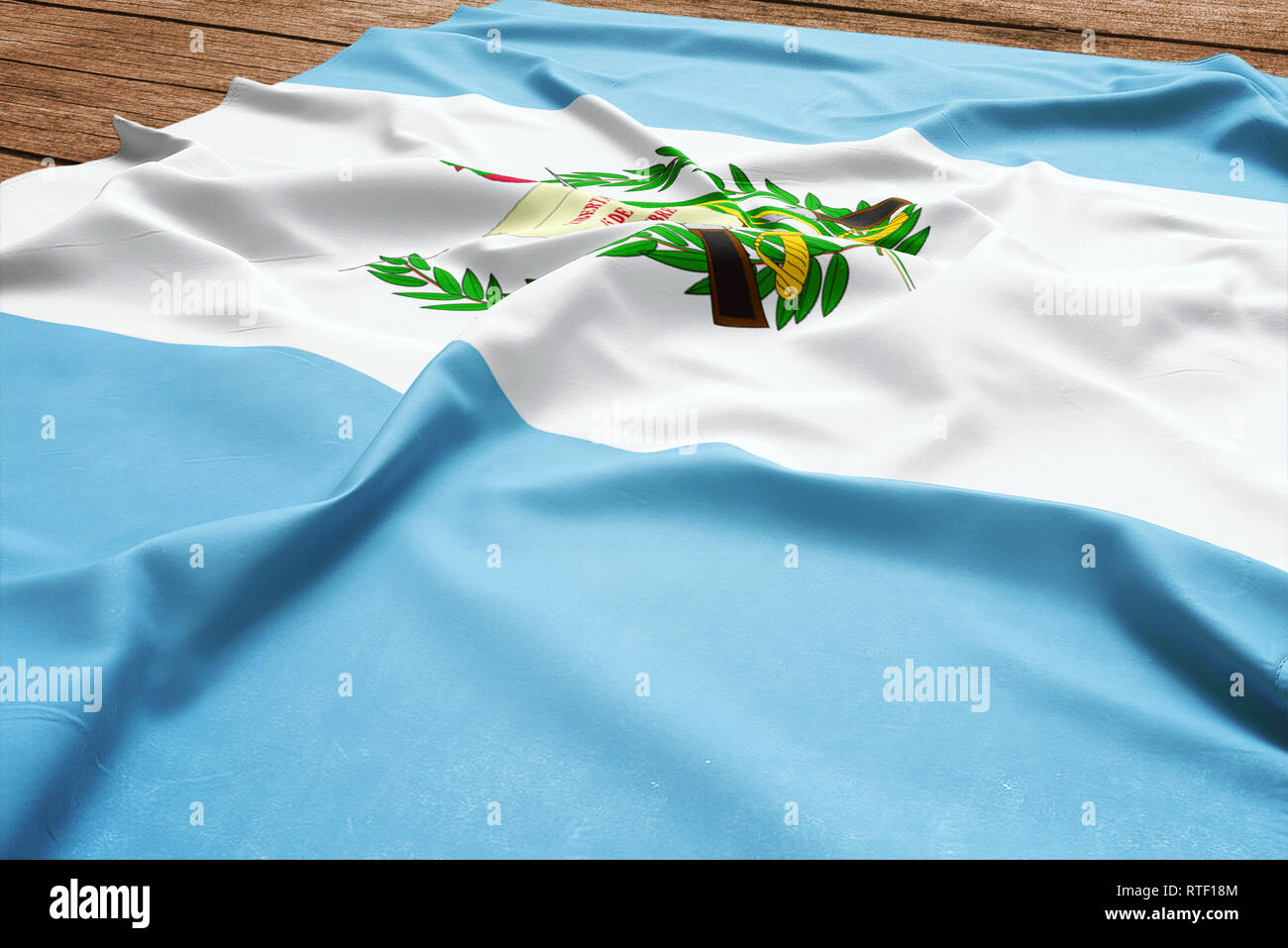 Flag of Guatemala on a wooden desk background. Silk Guatemalan flag top ...
