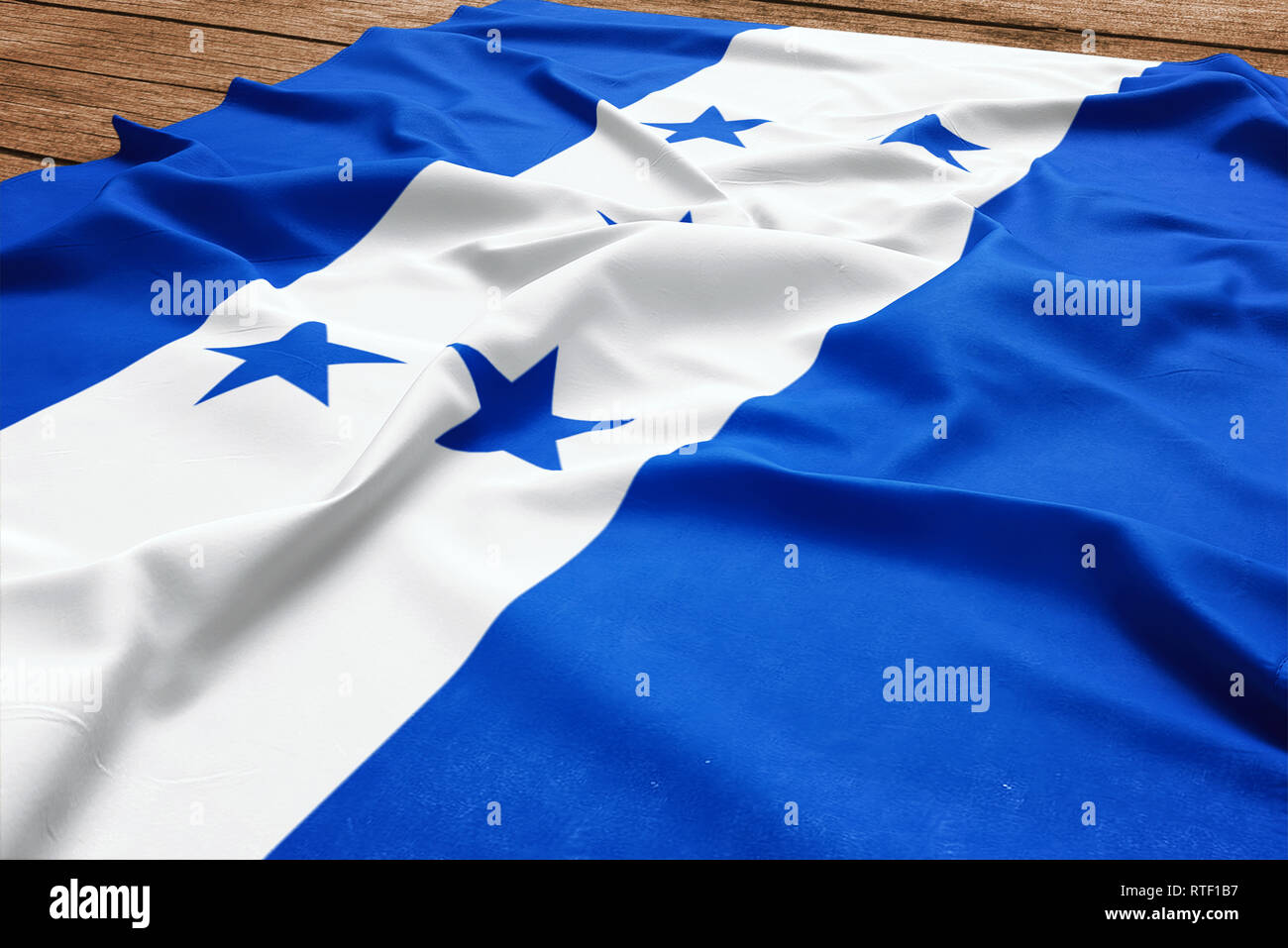 Flag of Honduras on a wooden desk background. Silk Honduran flag top ...