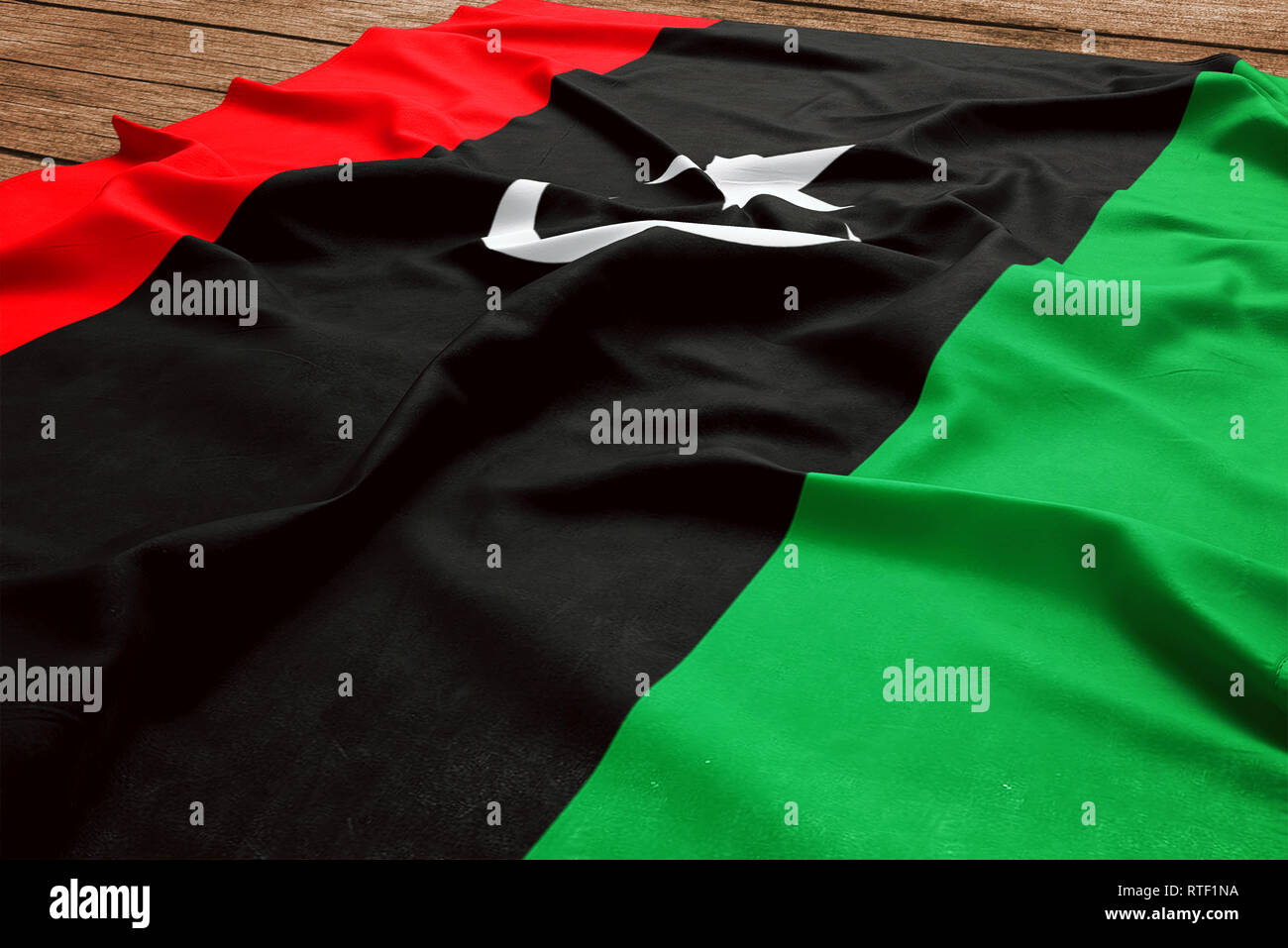 Flag of Libya on a wooden desk background. Silk Libyan flag top view ...