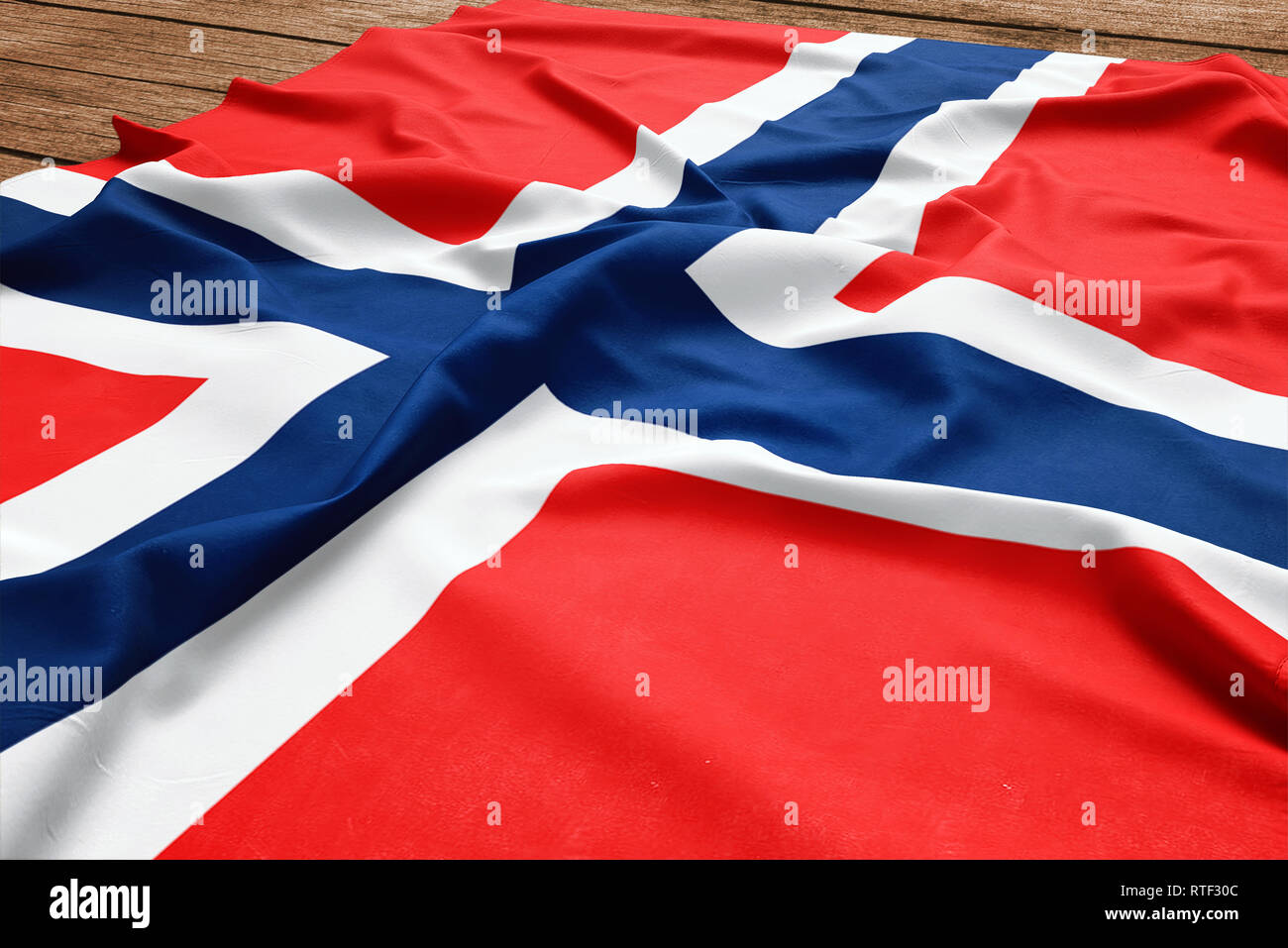 Flag of Svalbard And Jan Mayen on a wooden desk background. Silk flag ...