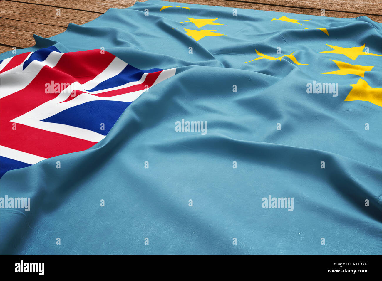 Flag of Tuvalu on a wooden desk background. Silk Tuvaluan flag top view ...