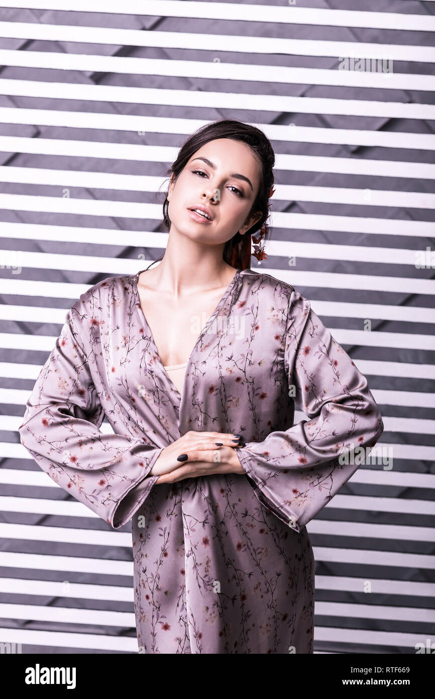 Portrait of alluring model displaying new sleeping wear collection ...