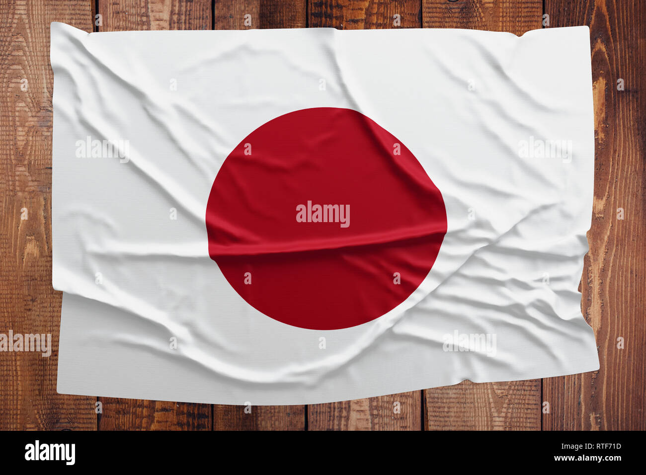 Flag of Japan on a wooden table background. Wrinkled Japanese flag top ...