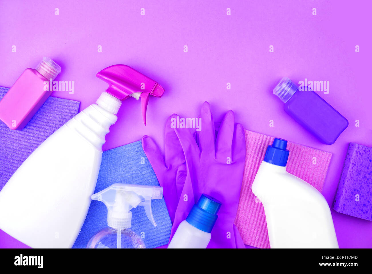 House cleaning products are on purple background Stock Photo - Alamy