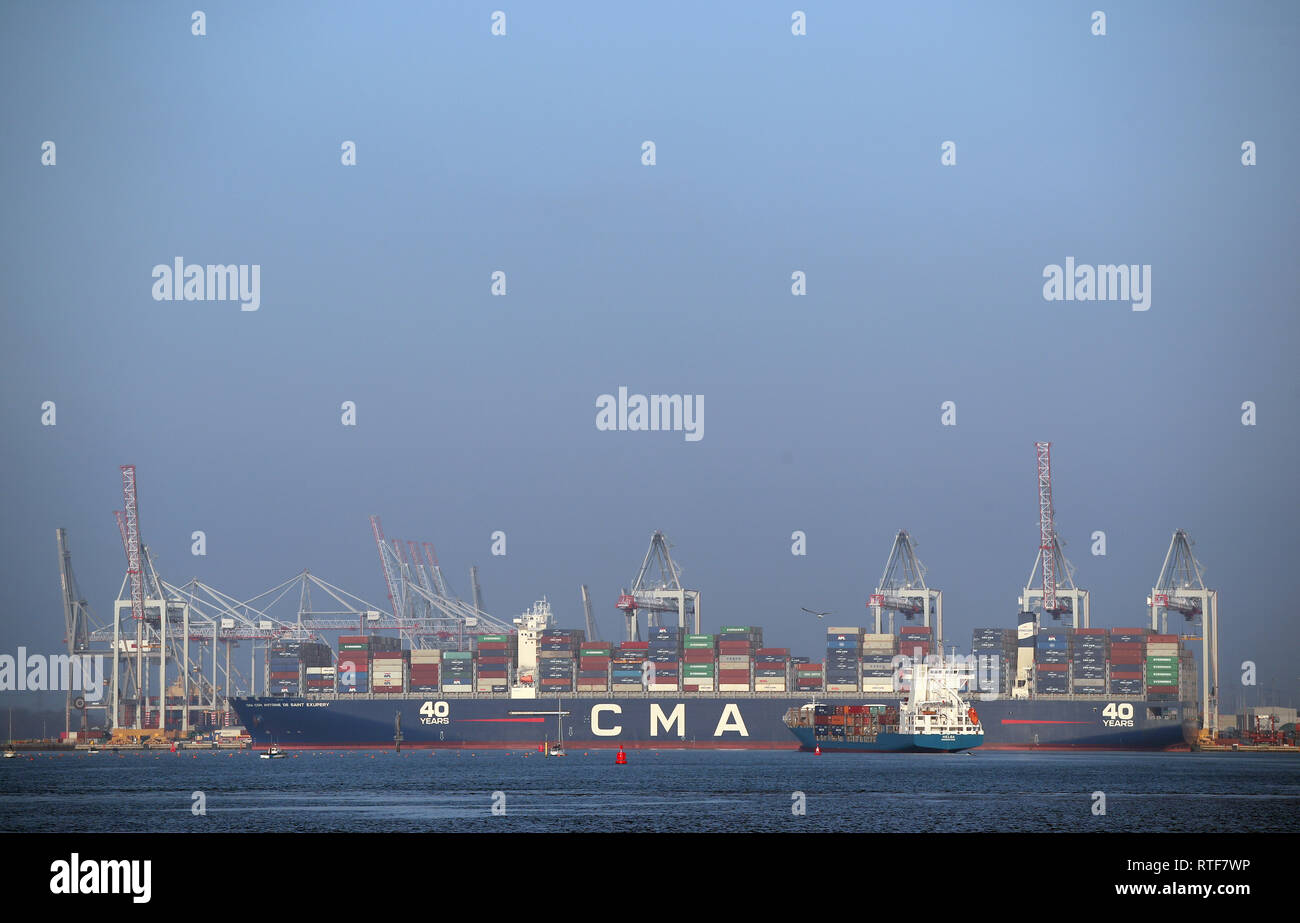 The container ship Helga makes her way past the container ship CMA CGM ...