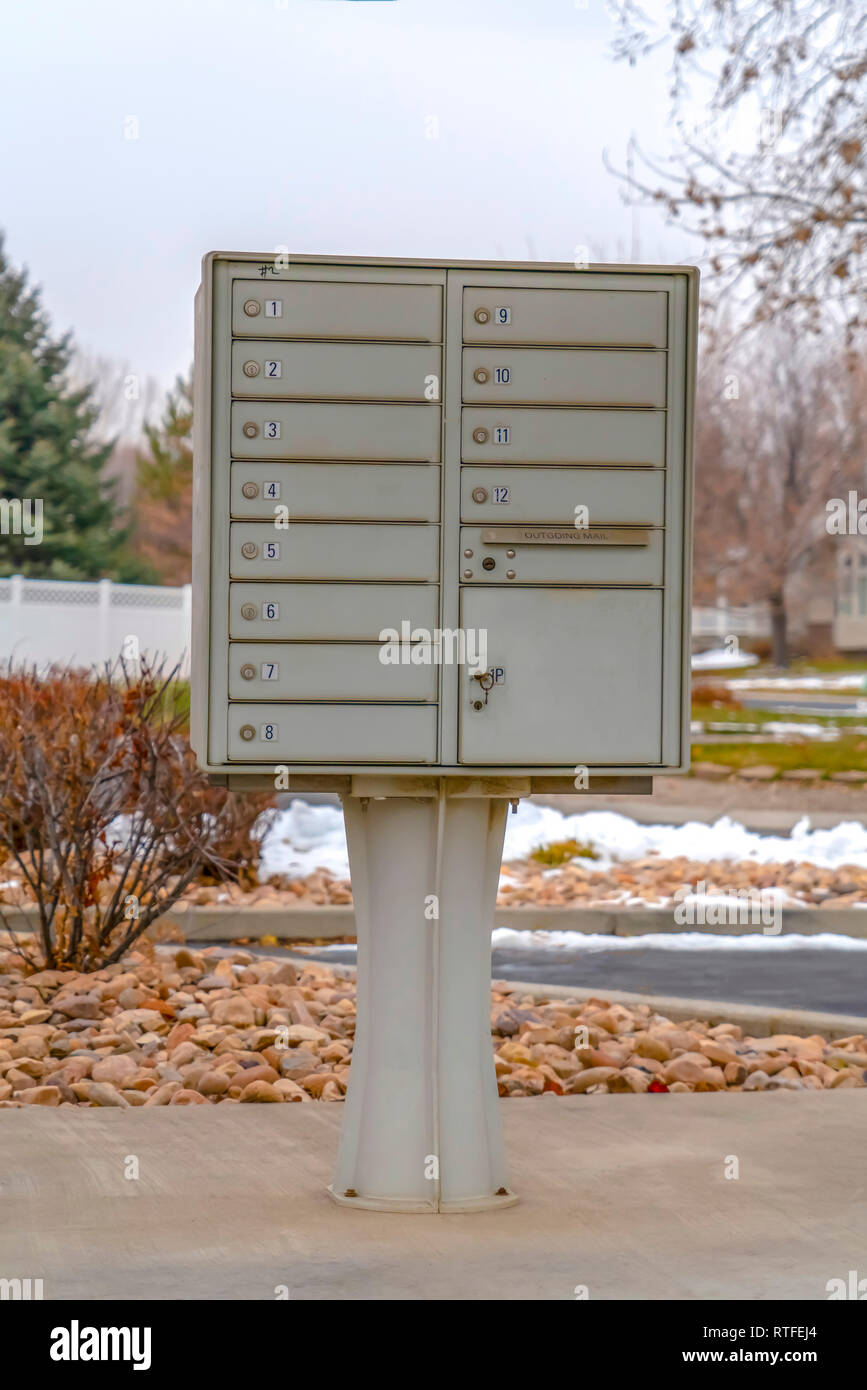 Outdoor mailbox with numbered compartments. An outdoor mailbox with ...