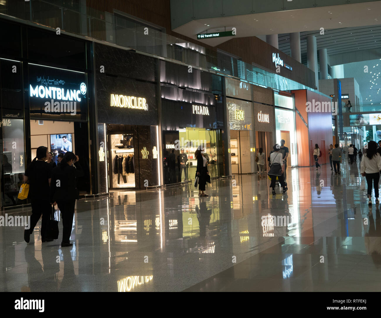 Incheon International Airport's shopping concourse with duty free shops ...