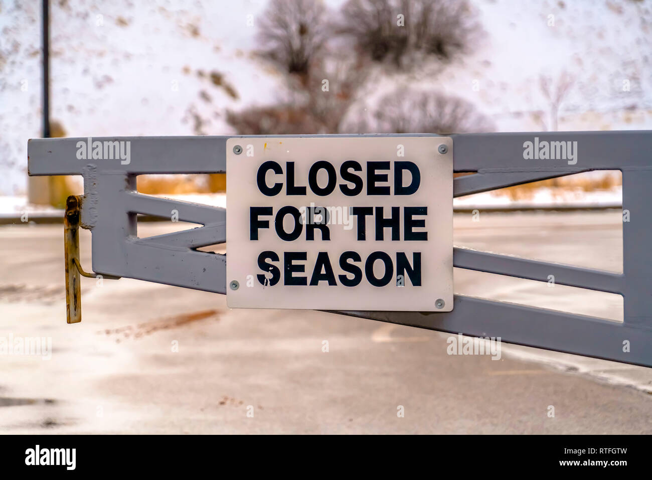 Closed For The Season sign on a gate. Close up view of a Closed For The ...