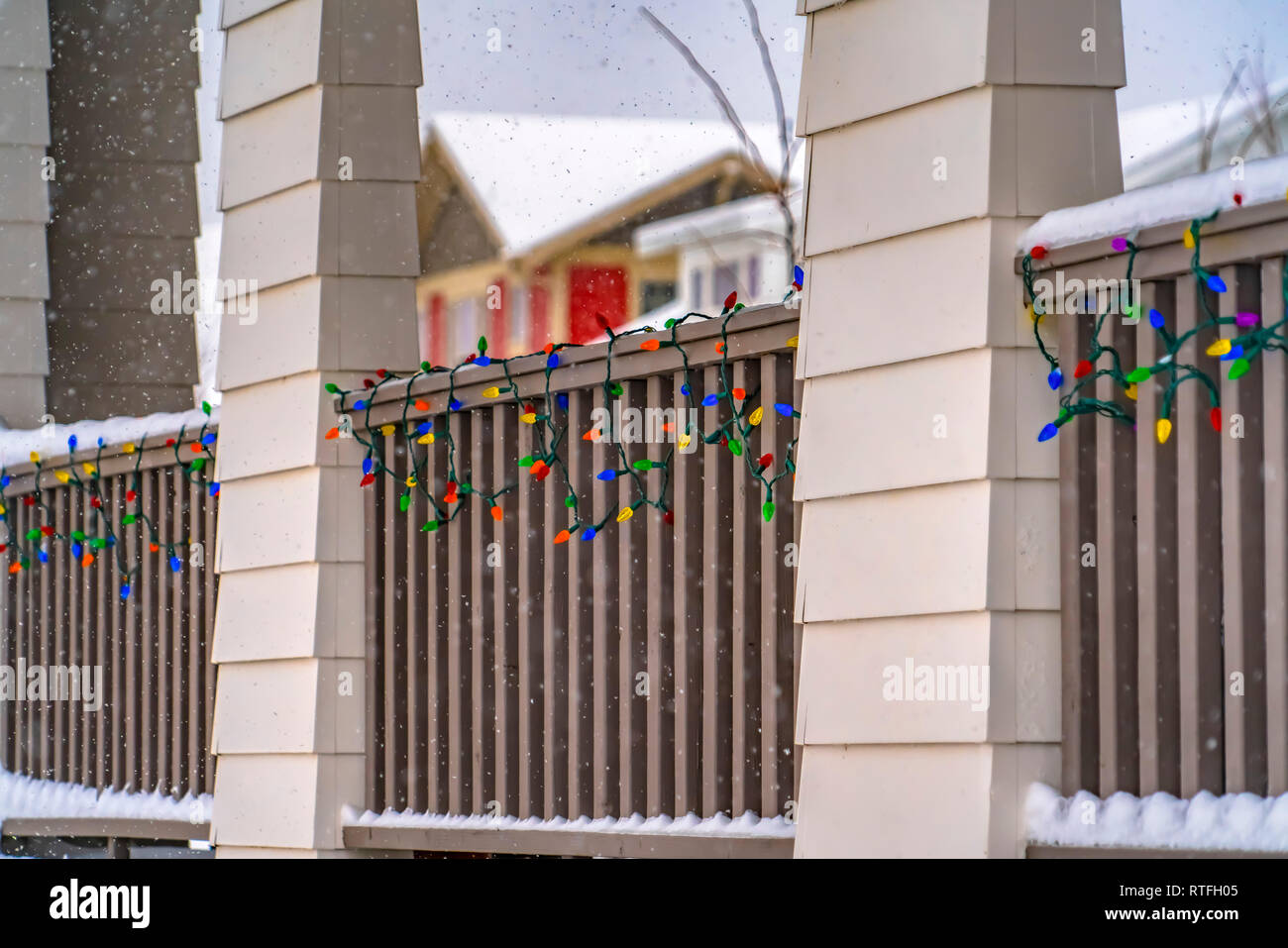 Colorful lights on a railing of a home in Daybreak. Bright colorful ...