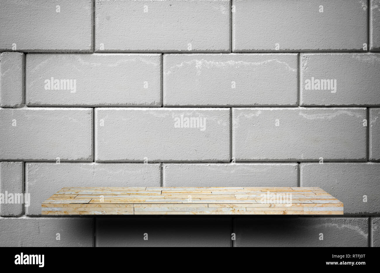 yellow stone rock shelf counter on gray brick for product display Stock ...