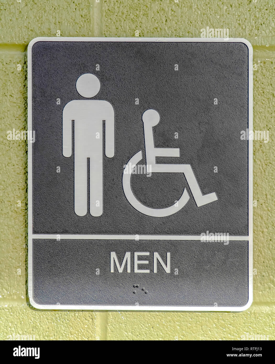 Men restroom sign posted on a green wall. Close up view of a restroom ...