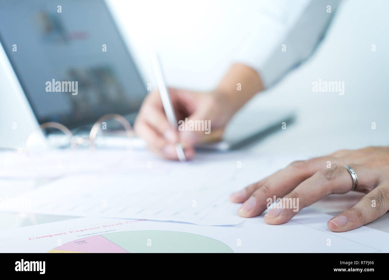 Office worker is analyzing paper and chart infomation Stock Photo - Alamy