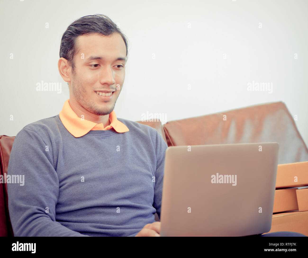 Business man is shocking looking at Laptop computer Stock Photo - Alamy