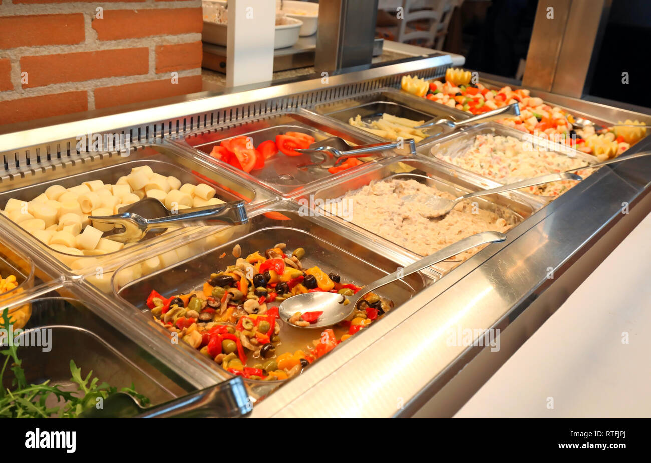 self service restaurant with many raw and cooked foods Stock Photo - Alamy