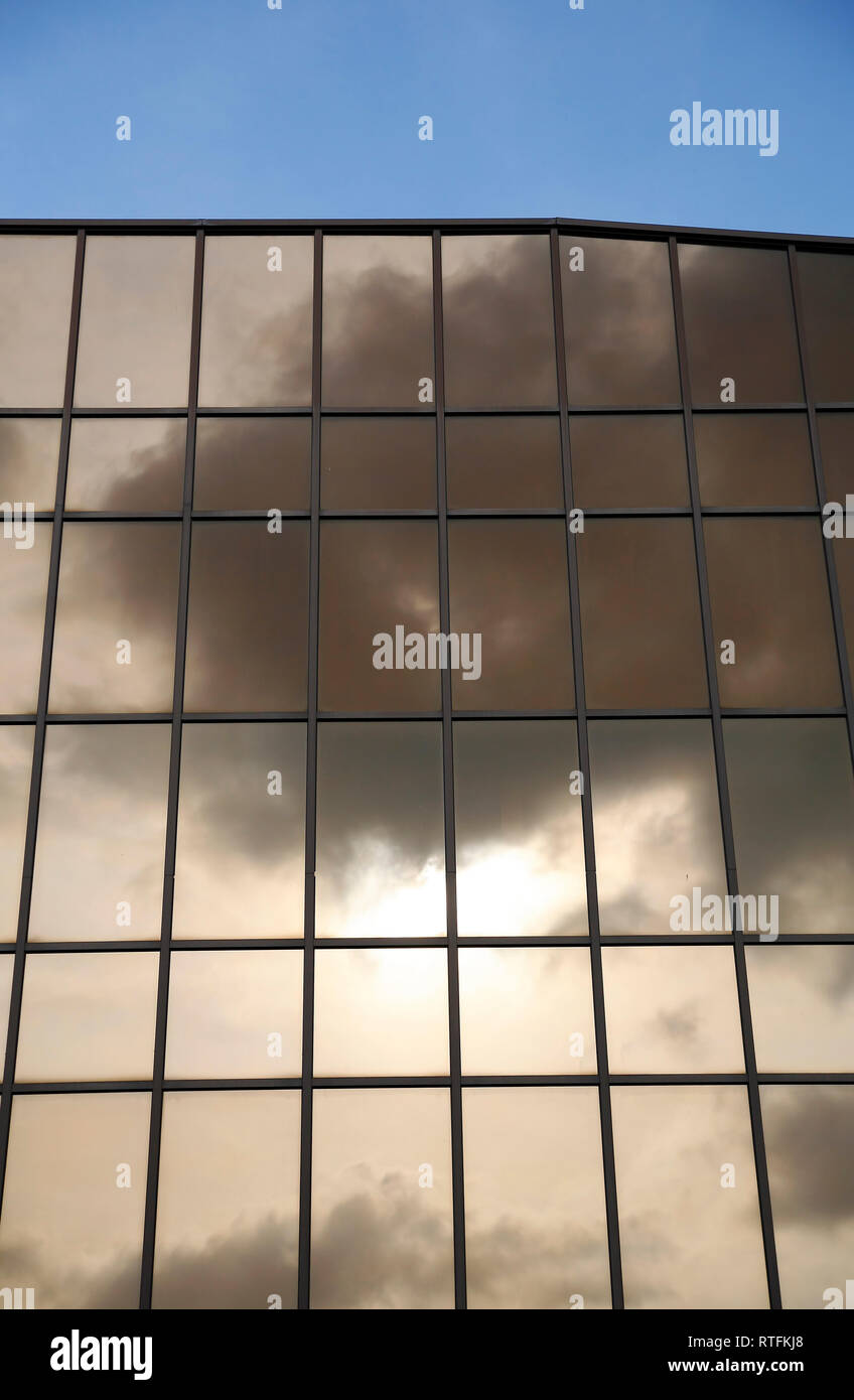 glass wall of modern trade center over the blue sky Stock Photo - Alamy
