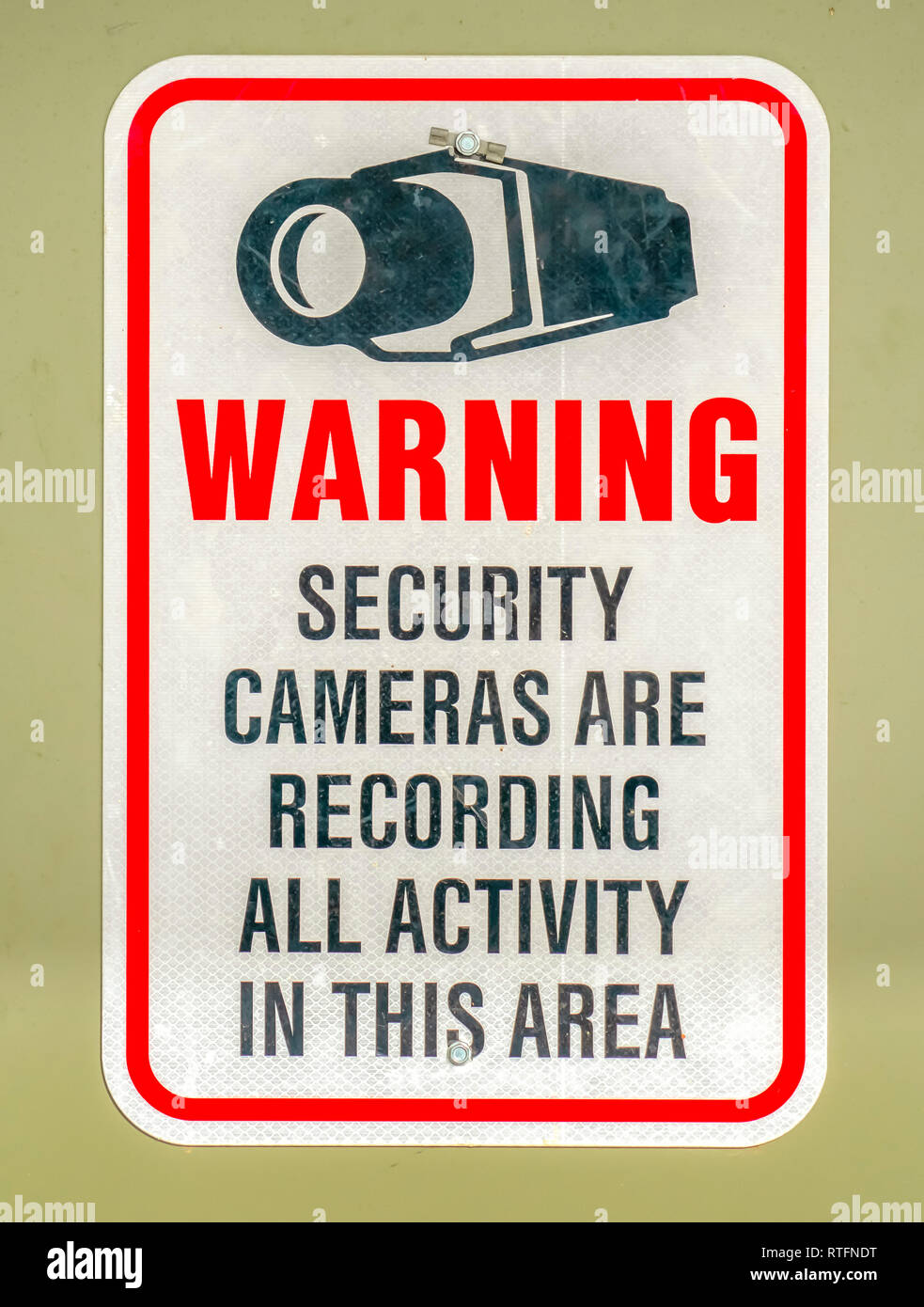 Warning sign on an area with security cameras. Close up view of a ...