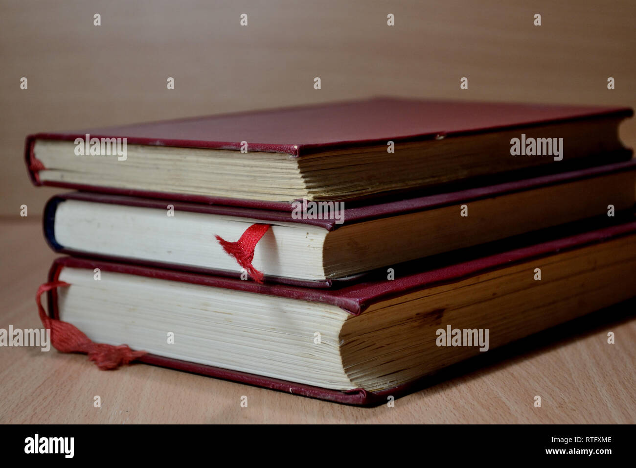 Stack of three old hardcover books Stock Photo - Alamy