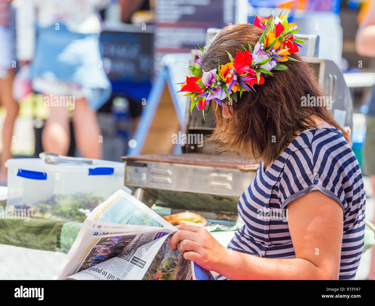 ARUTANGA, AITUTAKI, COOK ISLAND - SEPTEMBER 30, 2018: Woman in a wreath ...