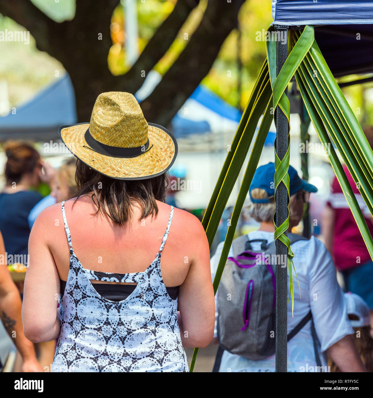 Woman in a hat on a city street, Rarotonga, Aitutaki, Cook Islands ...