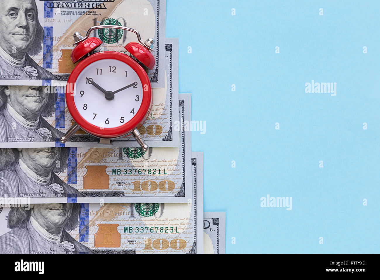 Retro alarm clock on a colored background. Concept - time is money ...