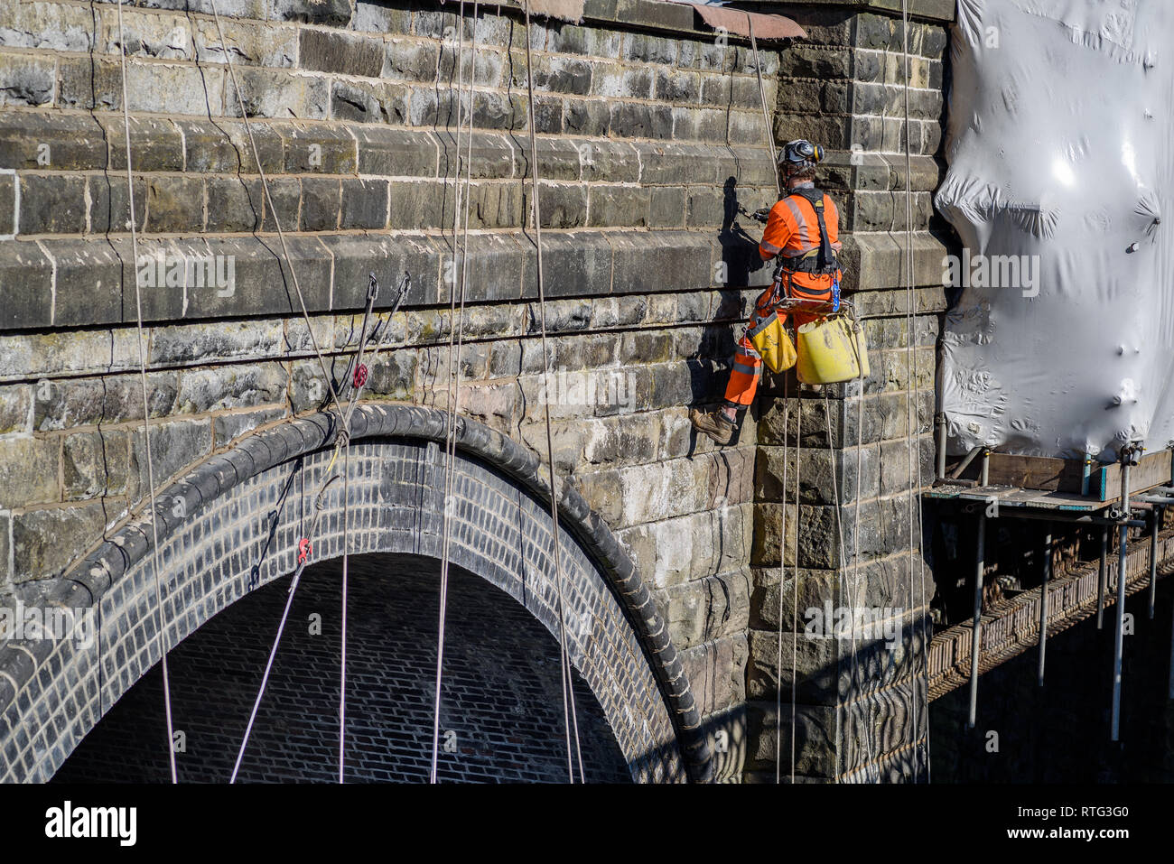 The old viaduct bridge at Millers Dale, Derbyshire in the Peak District ...