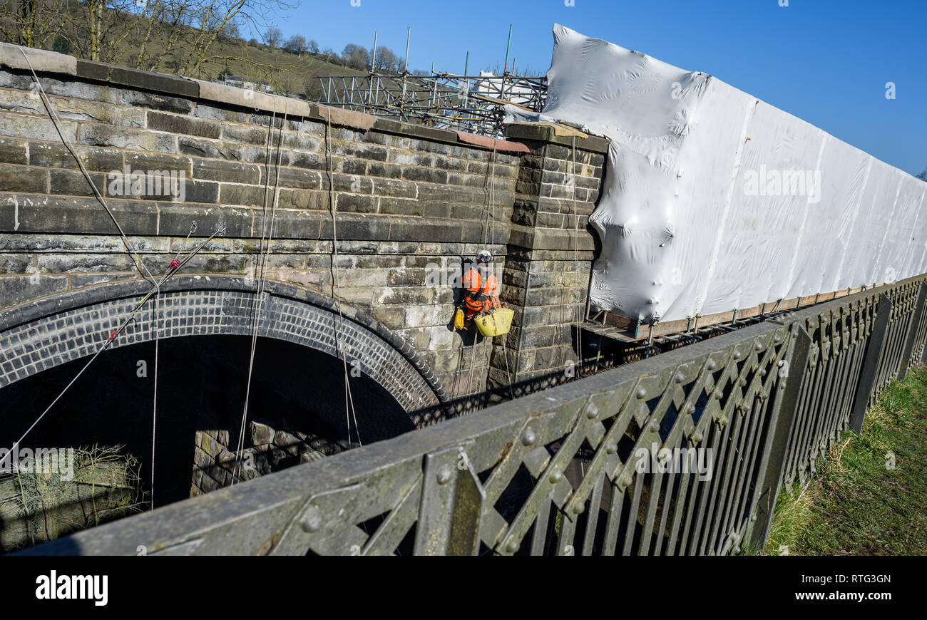 The old viaduct bridge at Millers Dale, Derbyshire in the Peak District ...