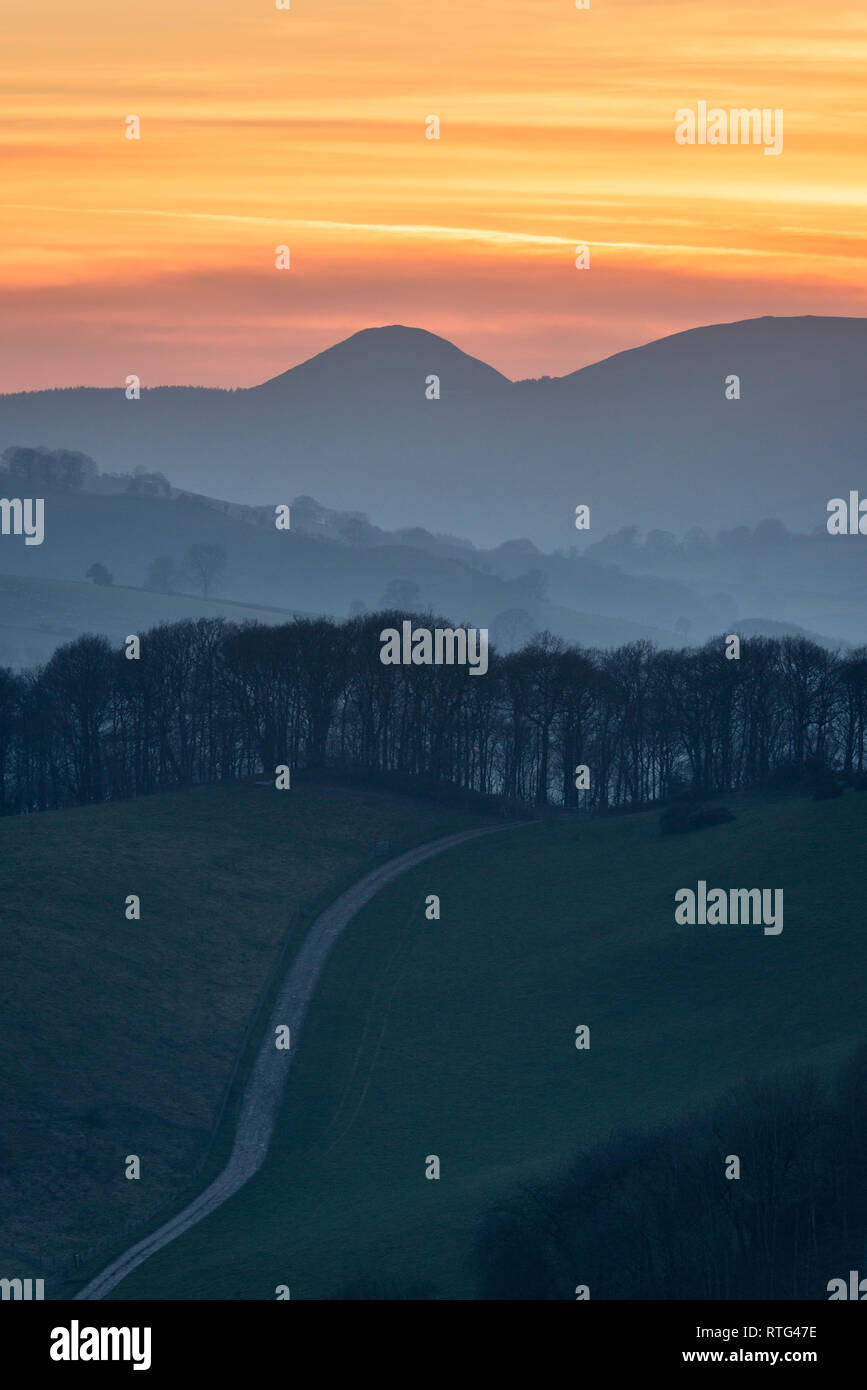 Powys, UK. Sunset over the peaceful Radnorshire countryside near ...