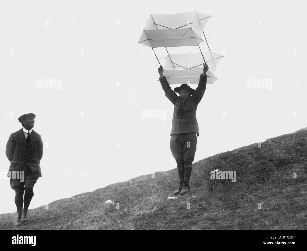italy, the top of bisbino mountain, boy scout throwing the kite flying ...